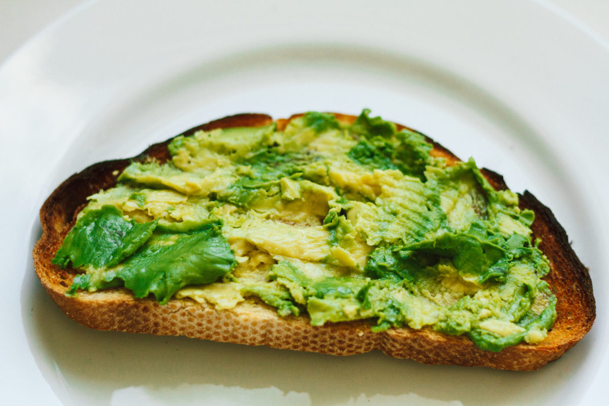 Avocado Toast with Heirloom Cherry Tomatoes, Vegan Feta, Arugula, and a ...